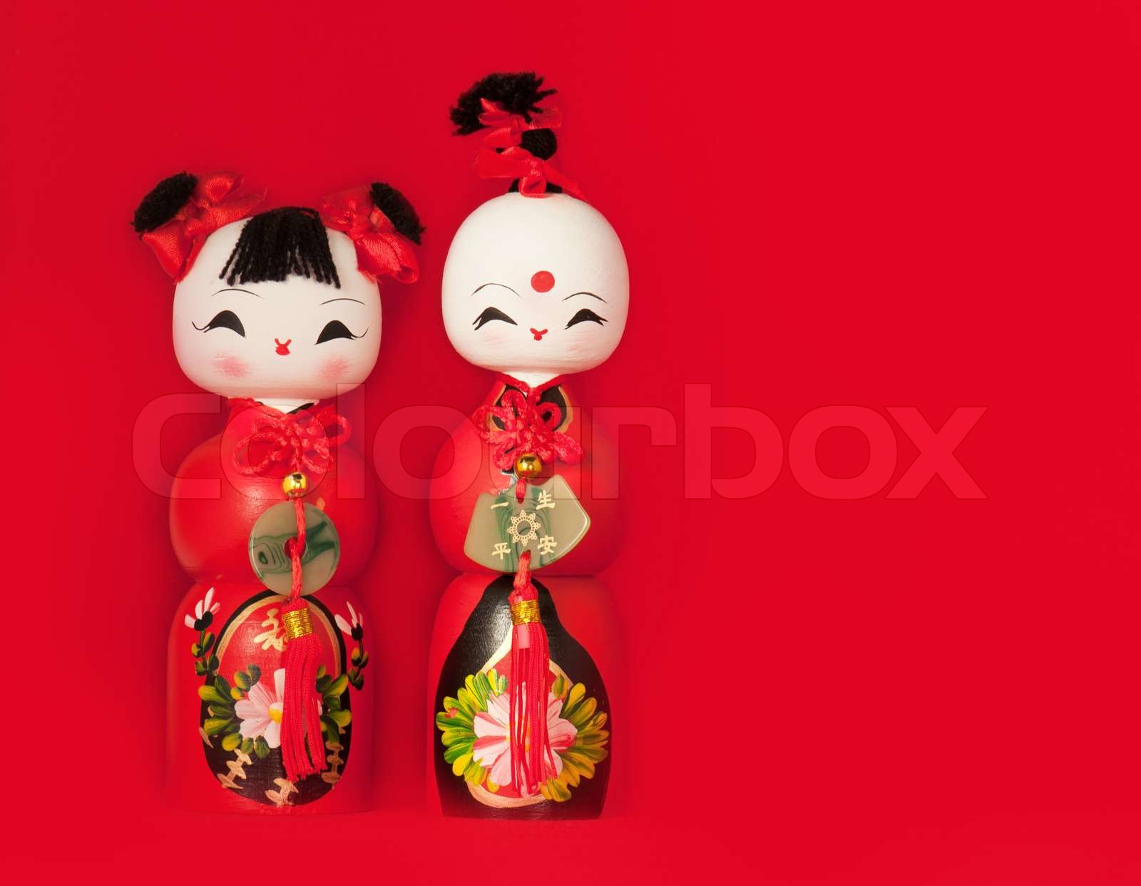 Two traditional Chinese wooden dolls | Stock image | Colourbox