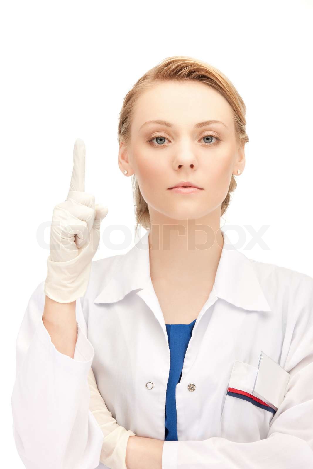 attractive female doctor with her finger up | Stock image | Colourbox