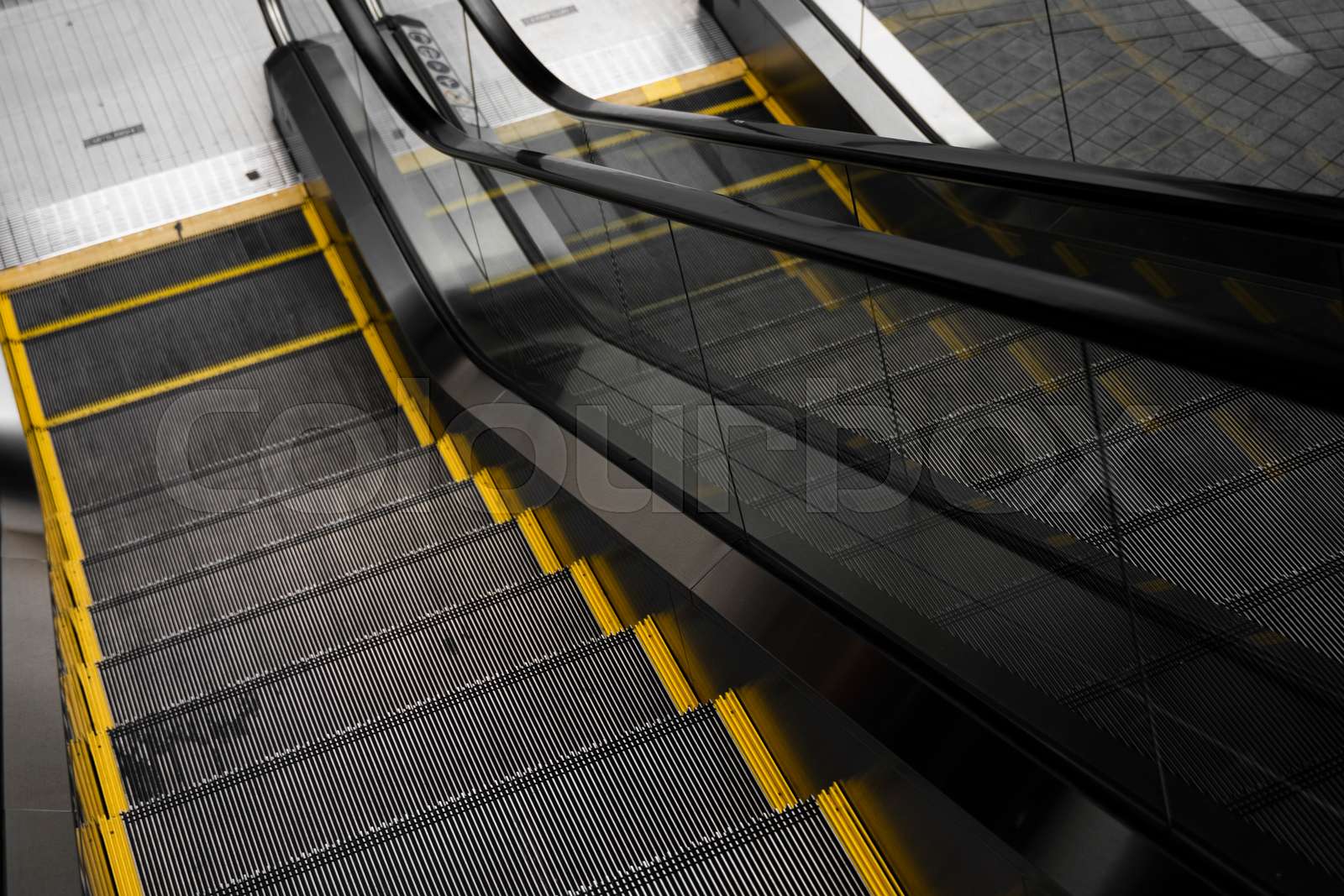 Empty escalators stairway with a yellow stripes. | Stock image | Colourbox