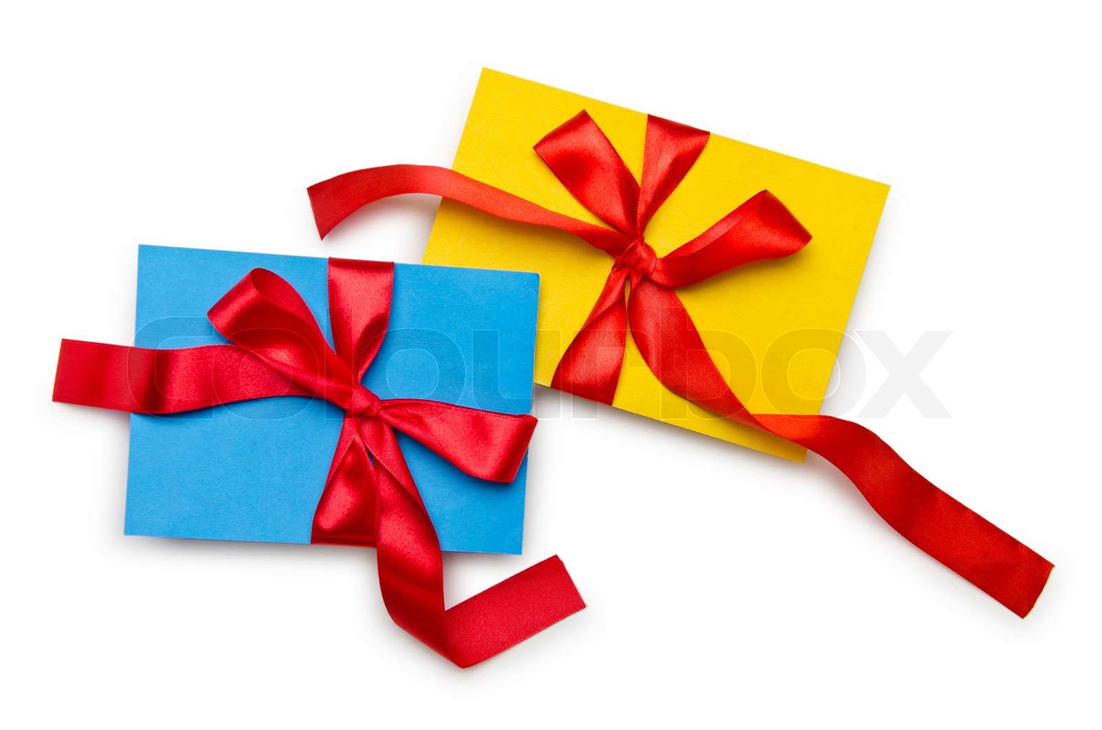 Envelope with colourful ribbon on white | Stock image | Colourbox