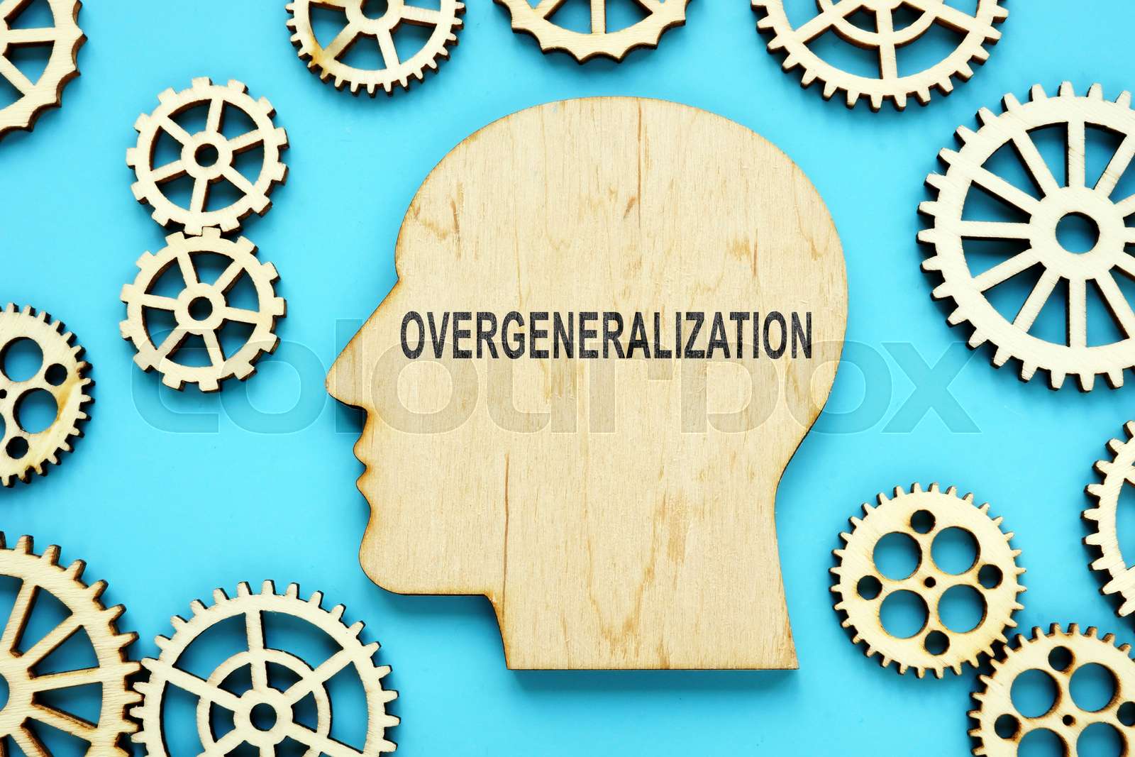 Overgeneralization word on the wooden head shape. Symptom of social ...