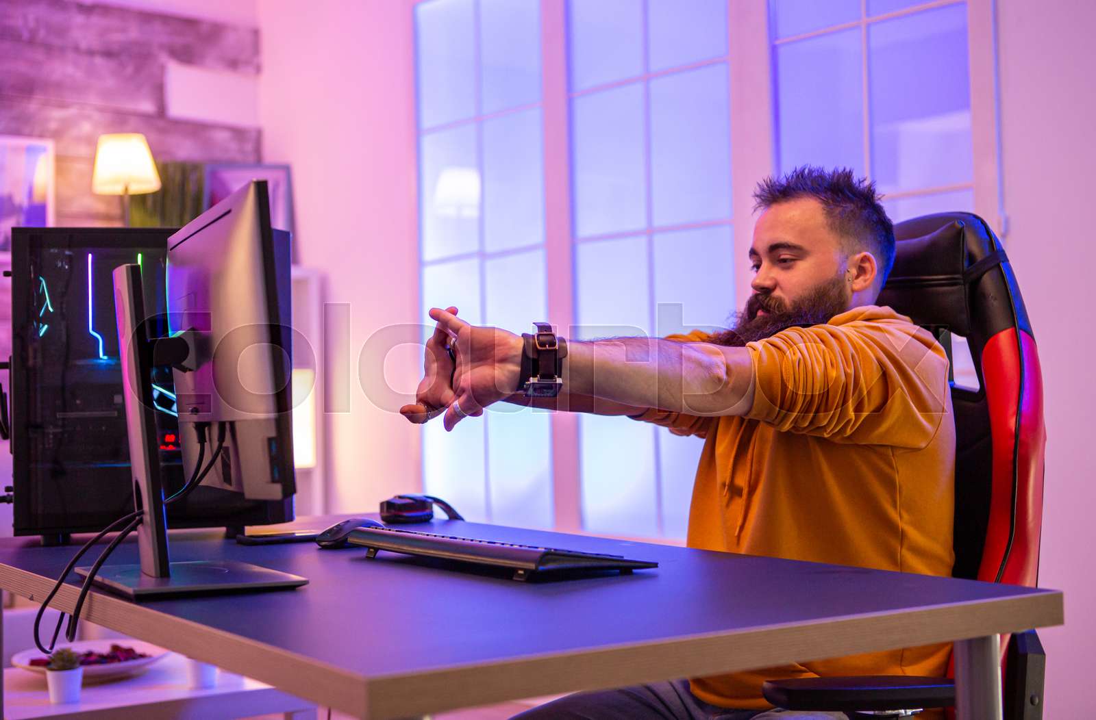 Bearded man sitting on gaming chair preparing to play video games ...