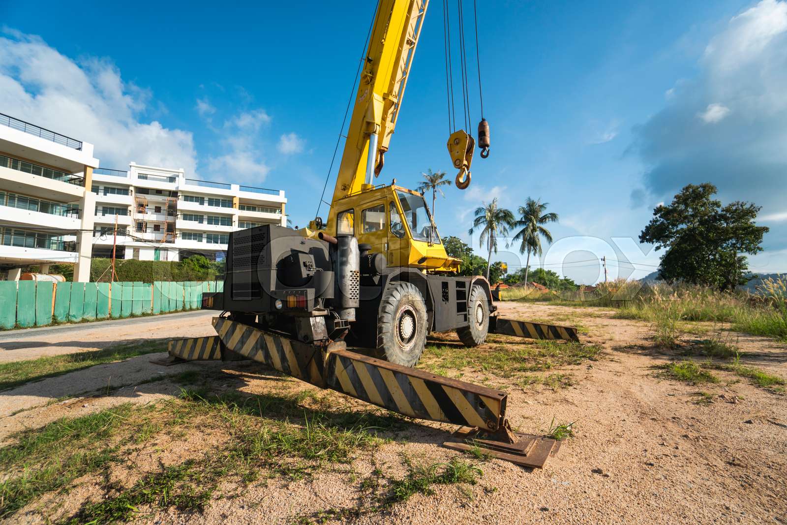 Yellow automobile crane with risen telescopic boom outdoors. Mobile ...