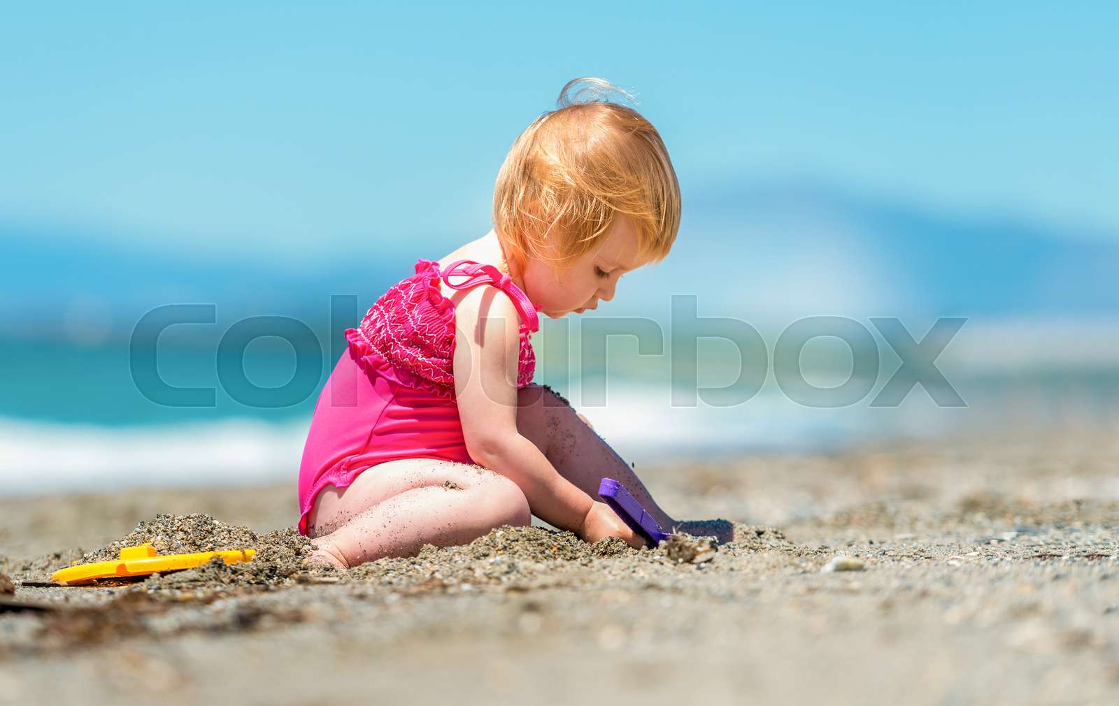 little cute girl playing in the sand | Stock image | Colourbox