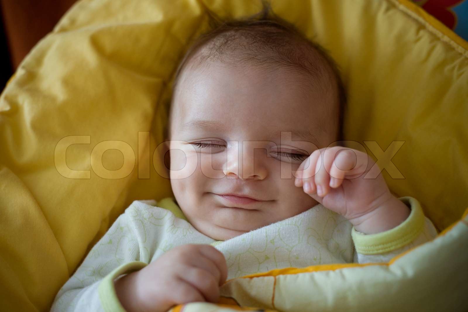 sleeping smiling newborn baby | Stock image | Colourbox