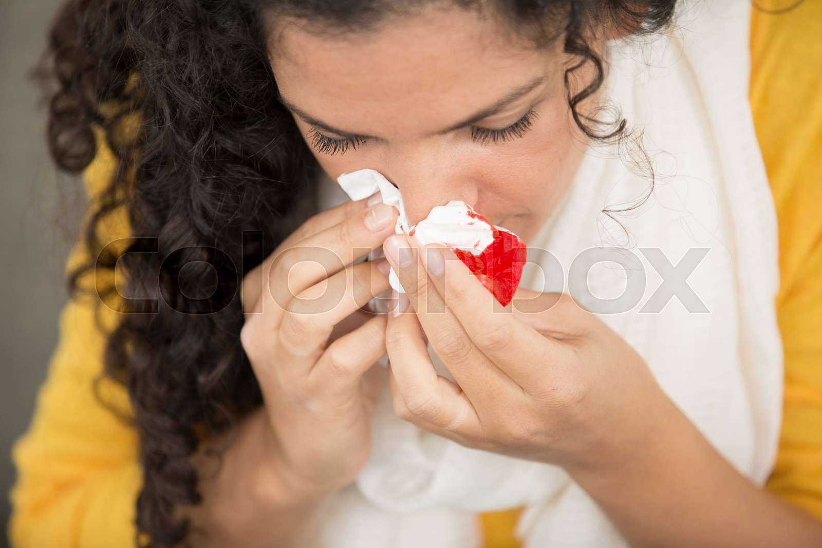 woman bleeding from her nose | Stock image | Colourbox