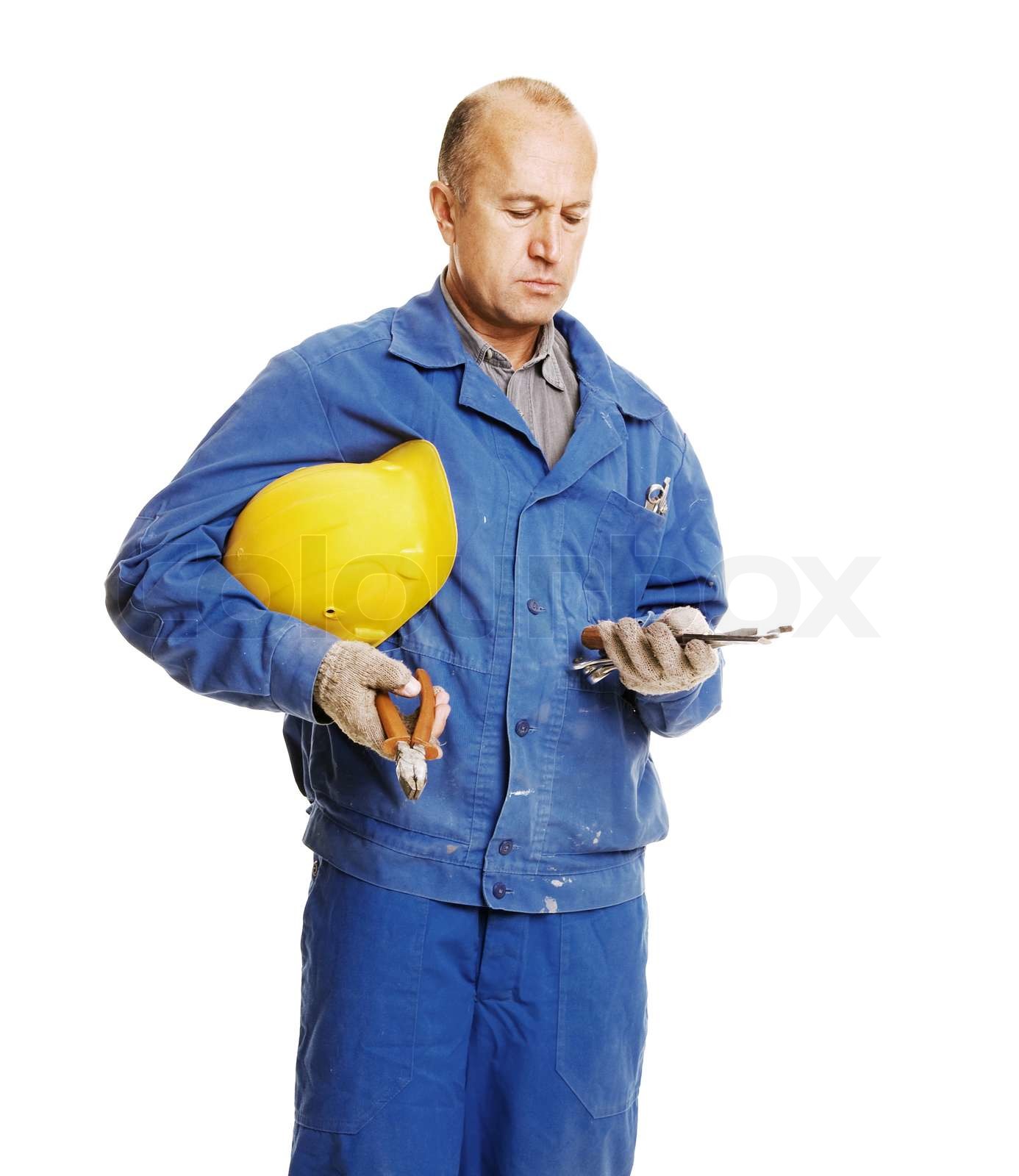 workman looking at tools | Stock image | Colourbox