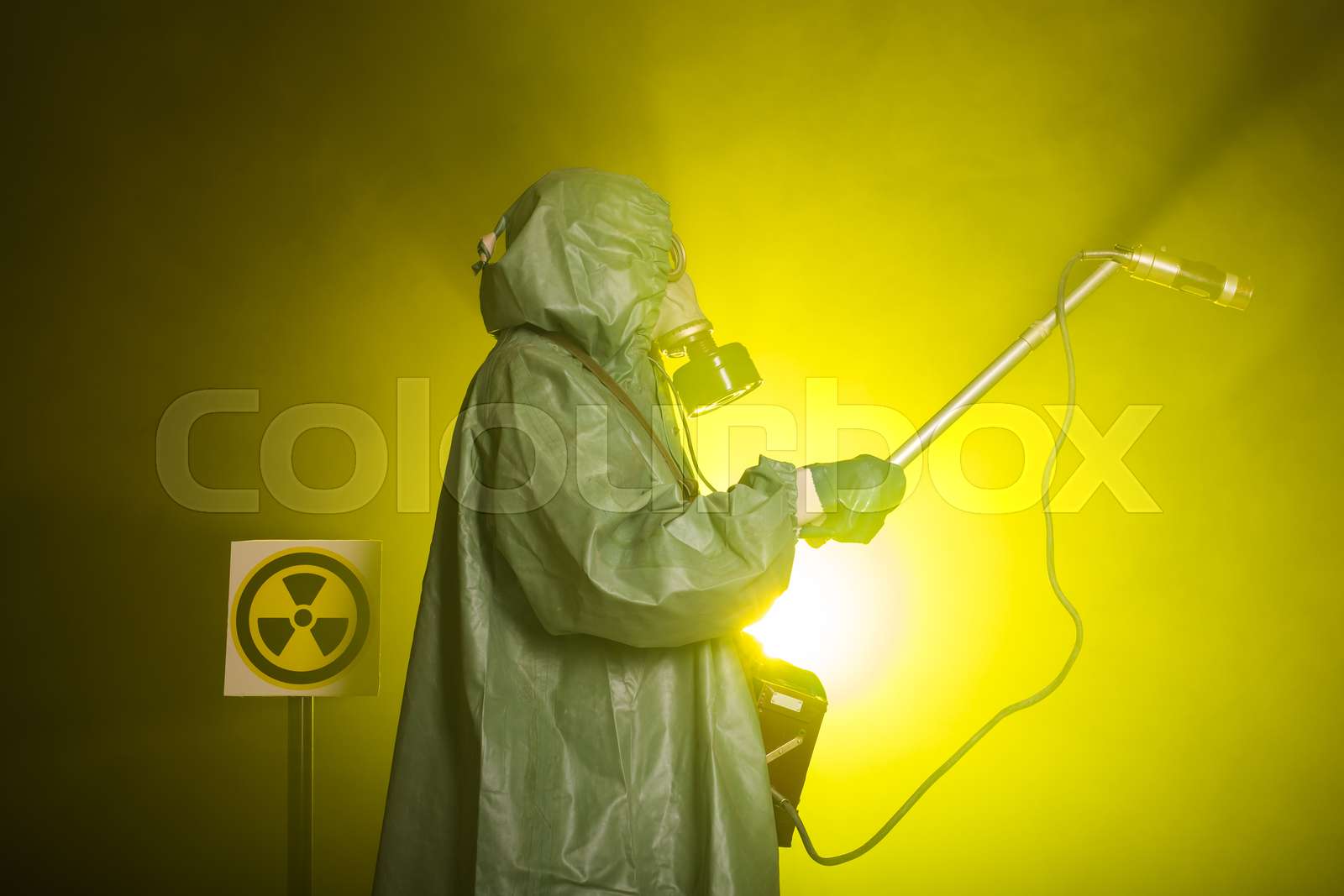 Radiation and danger concept - Man in the gas mask and chemical suit ...
