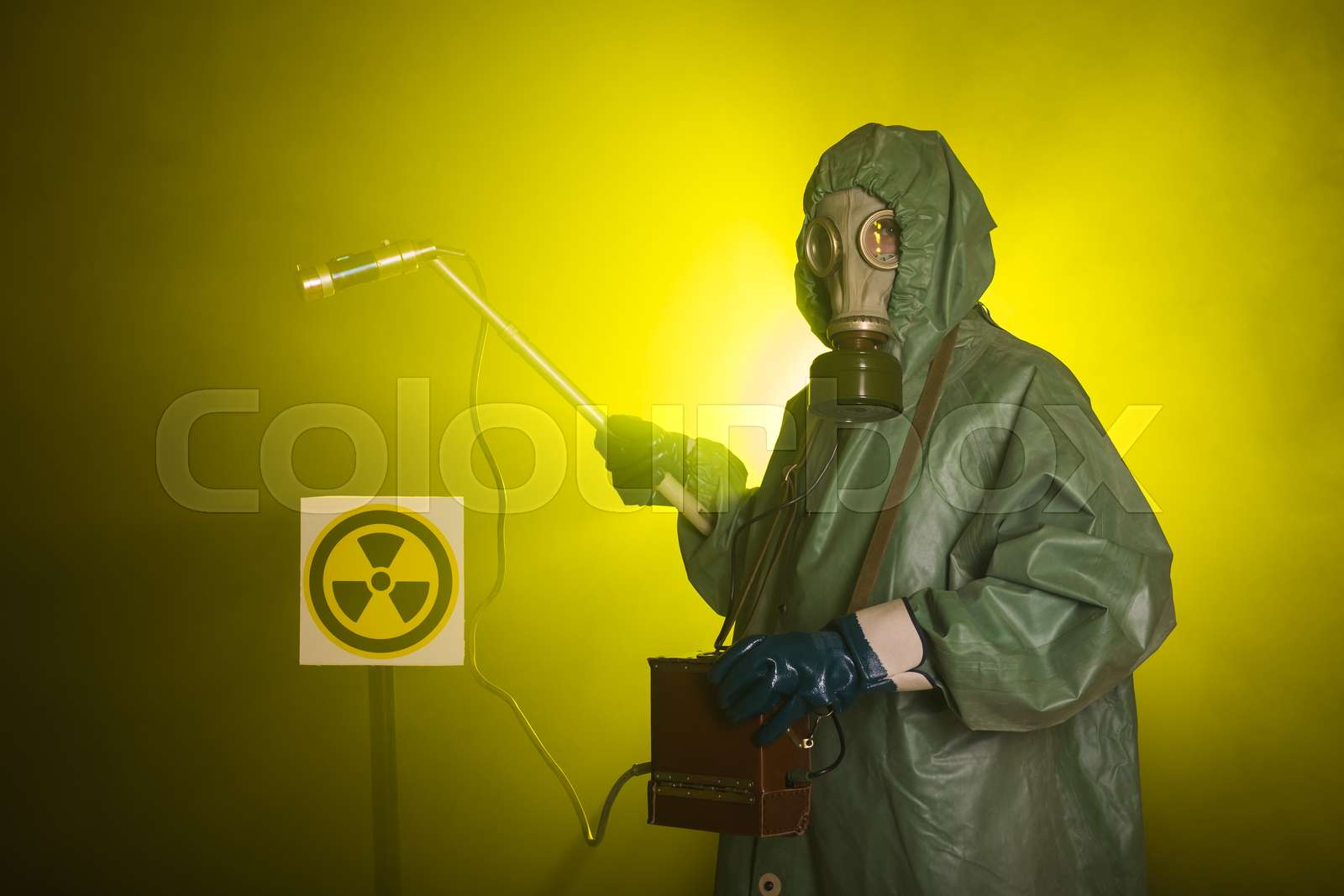 Radiation and danger concept - Man in the gas mask and chemical suit ...