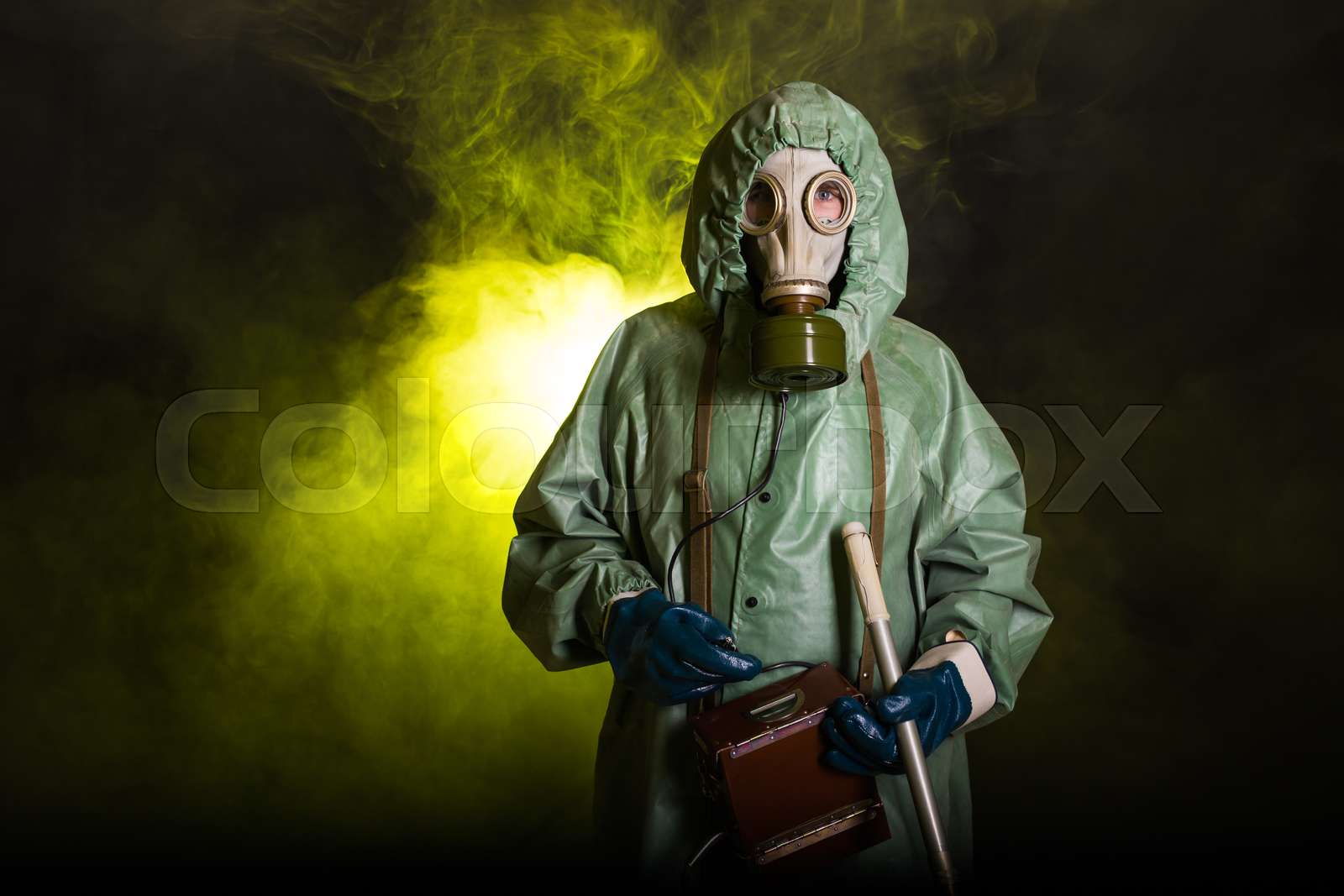 Radiation and danger concept - Man in the gas mask and chemical suit ...