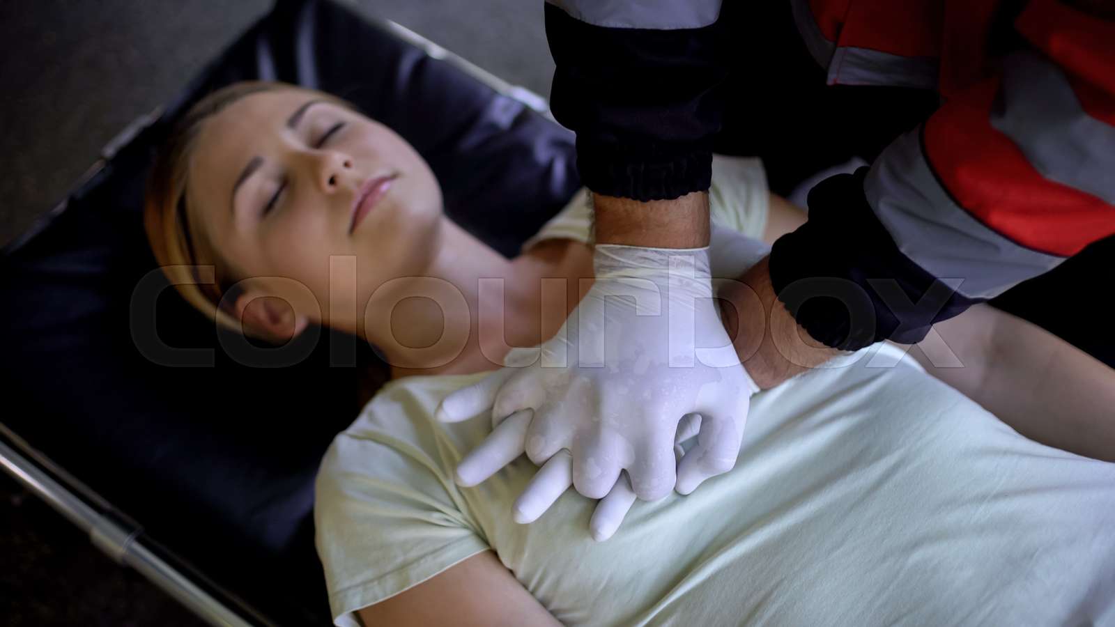 Doctor doing CPR to woman, patient death, mortality from road traffic ...