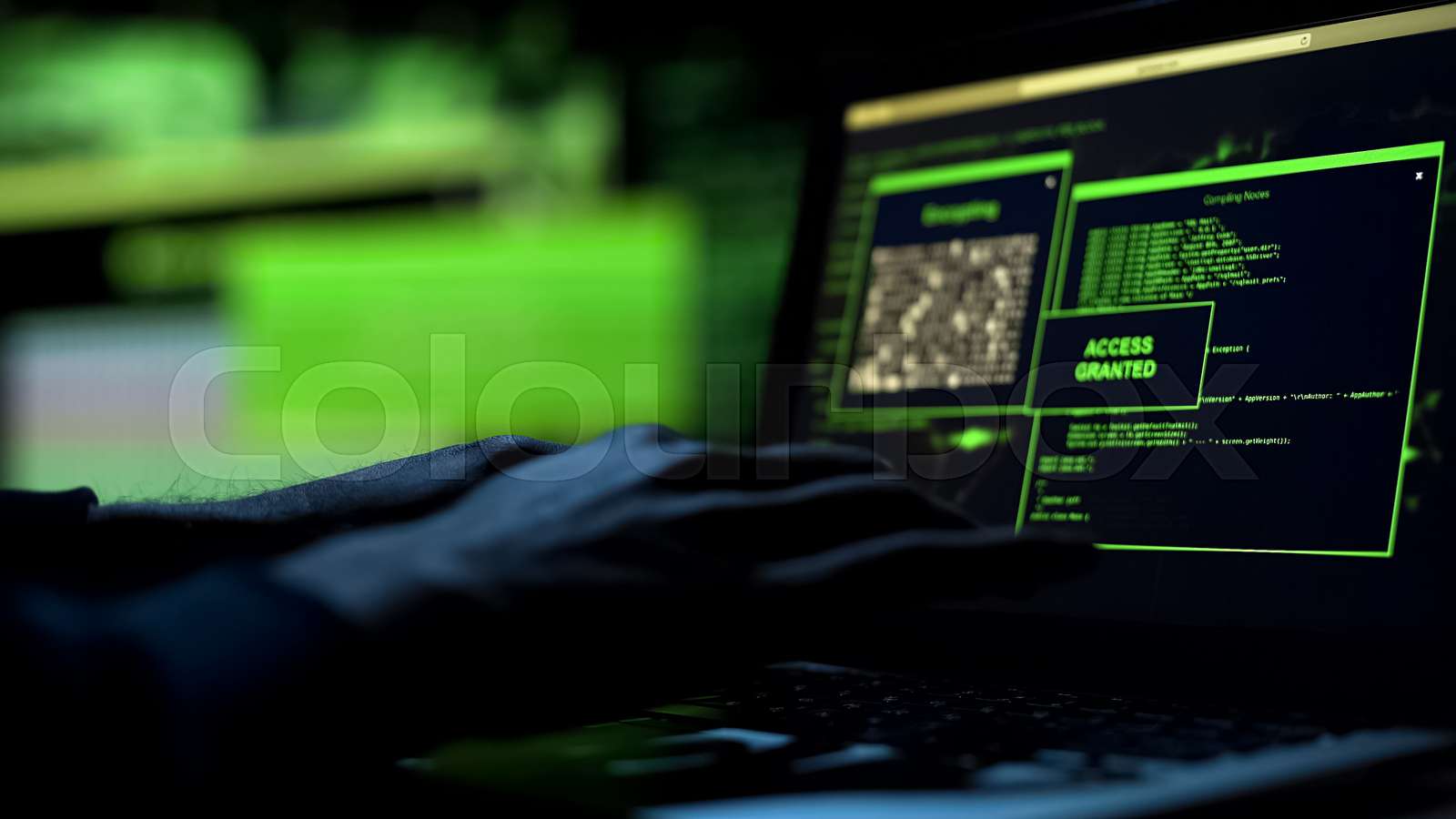 Close-up hacker hands working on laptop, selecting password, access ...