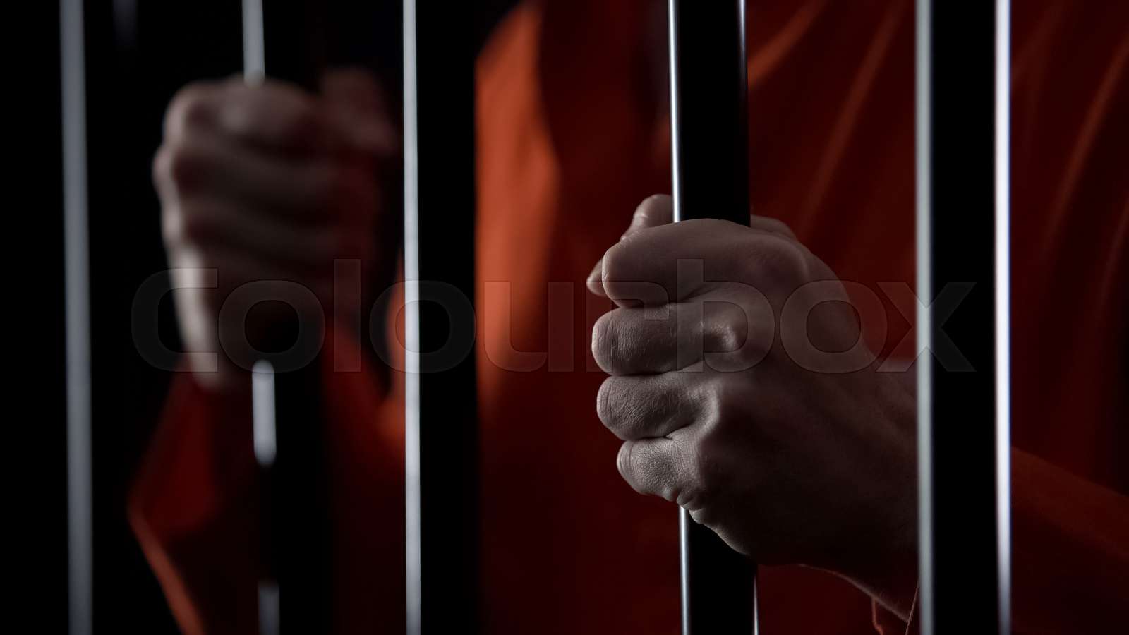 Hands of desperate arrested male holding prison bars, unfair judgment ...