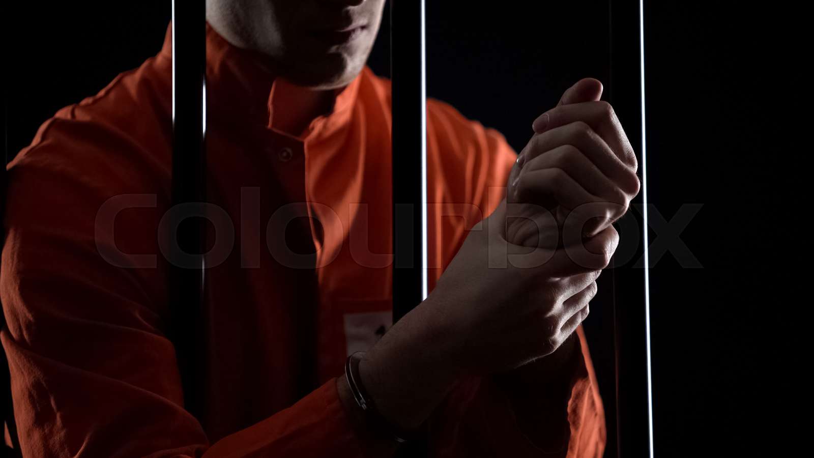 Inmate in handcuffs rubbing wrists, inhuman conditions and tortures in ...