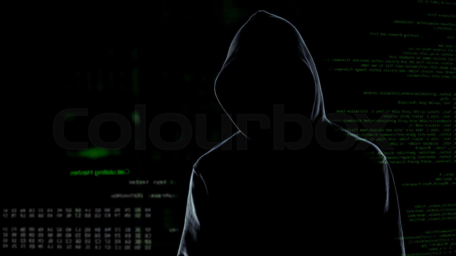Faceless male hacker in hoodie standing in front of animated computer ...