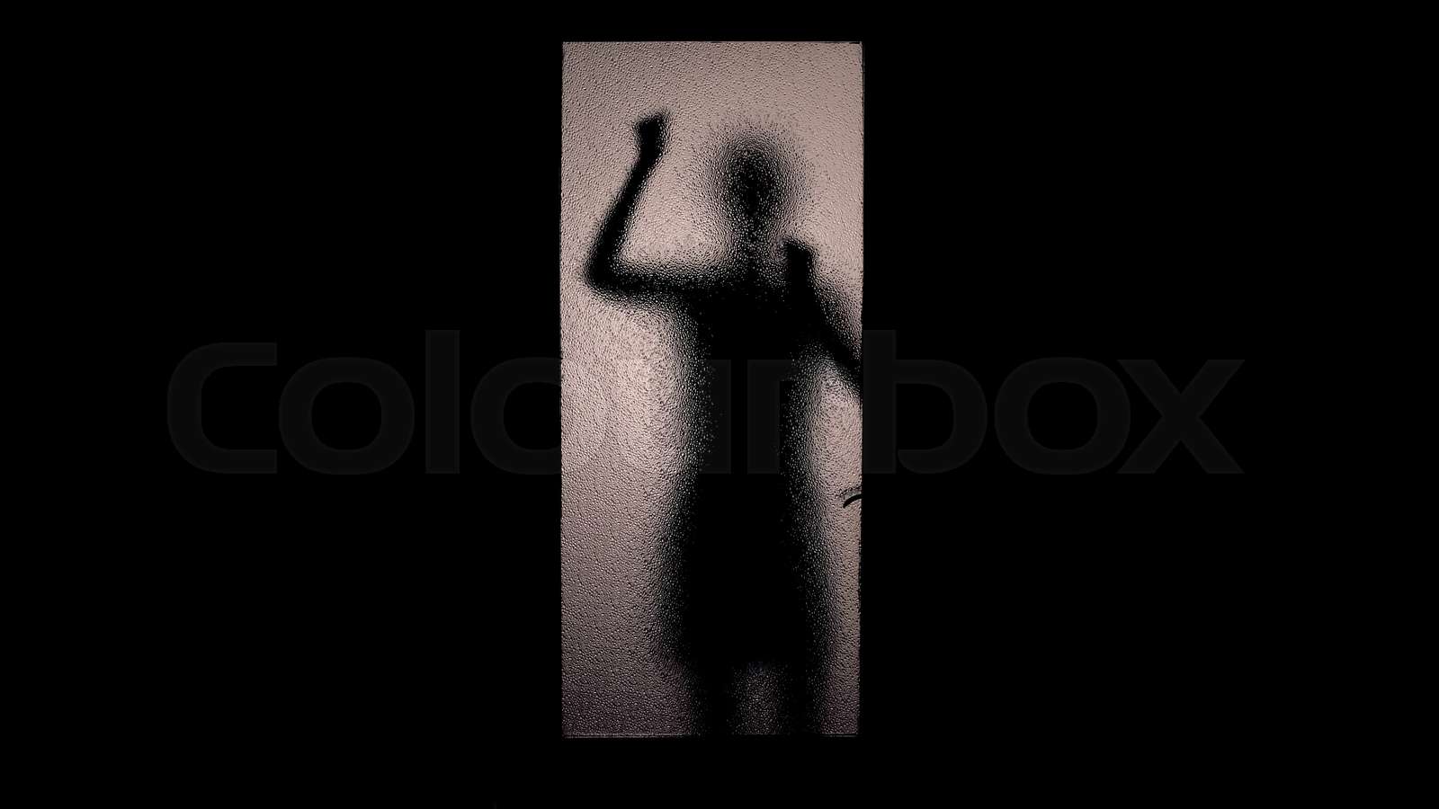 Silhouette of frightened woman knocking at glass door, trying to save ...