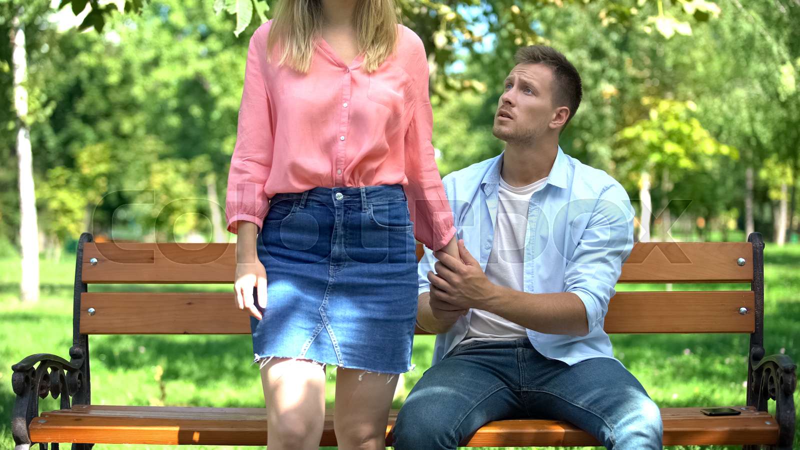 Desperate man holding girlfriend hand walking away, couple break-up ...