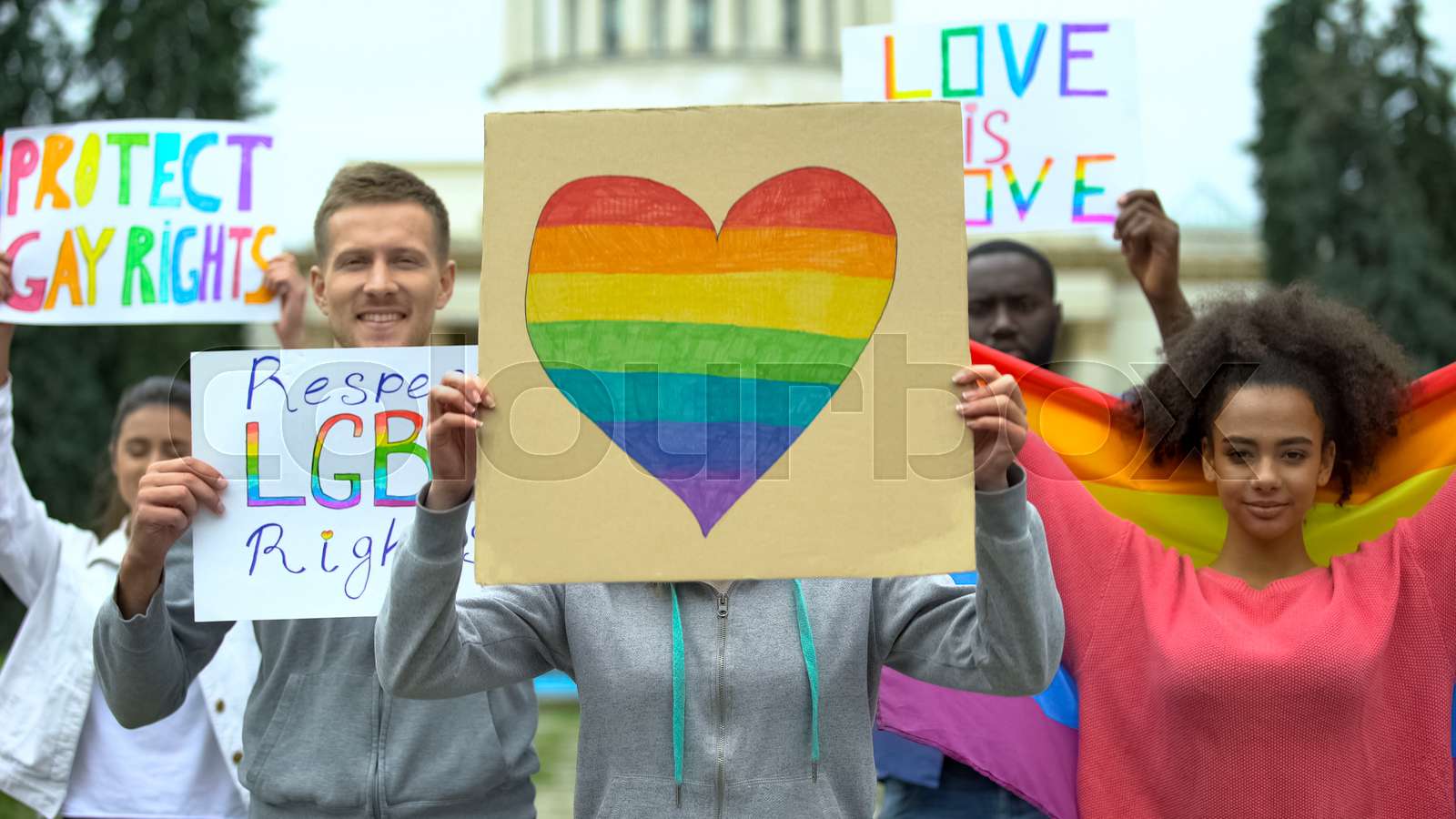 LGBT activists holding posters with rainbow symbols, demanding equal ...