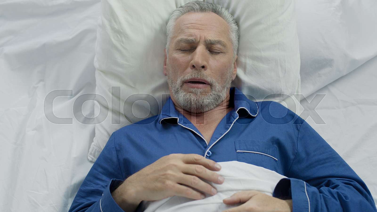 Aged male loudly snoring and puffing in bed, sleeping problems at old ...