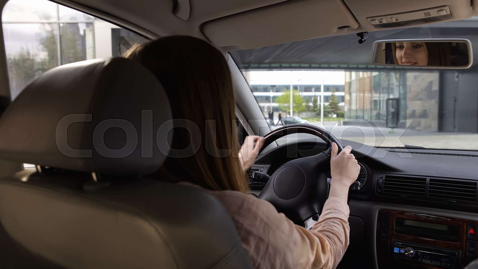 Business person sitting in car, female driver, comfortable transport ...