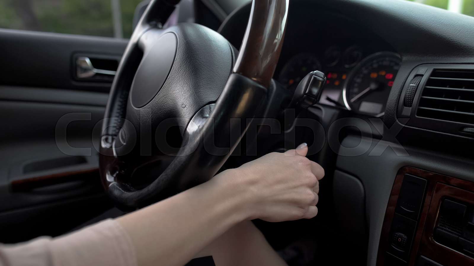 Female hand starting car engine, business woman driving luxury vehicle ...