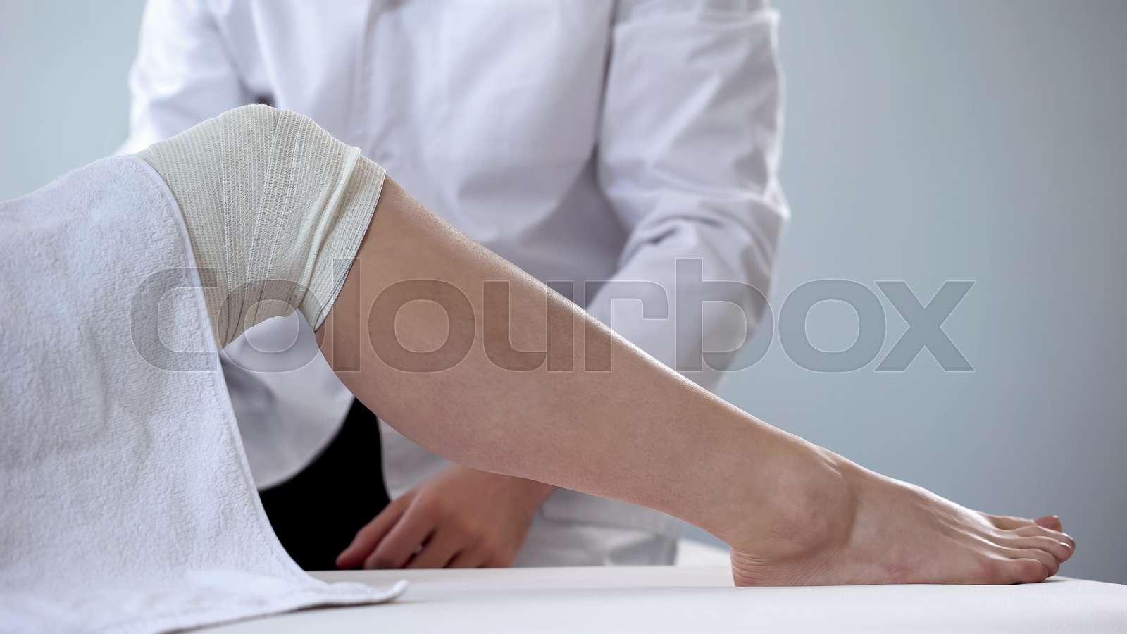 Doctor examining womans bandaged leg, venous varices, first aid for ...