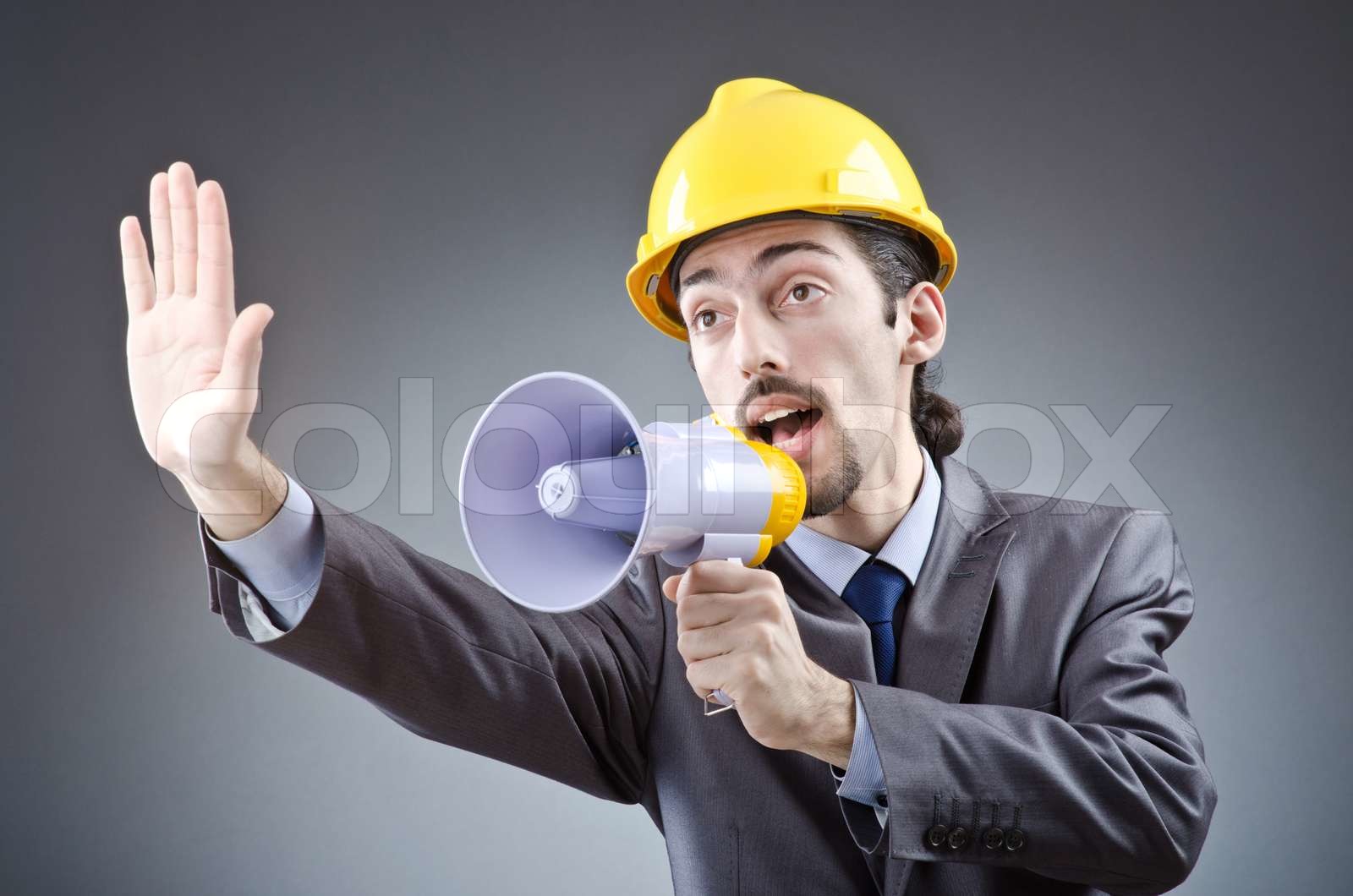 Man shouting and yelling with loudspeaker | Stock image | Colourbox