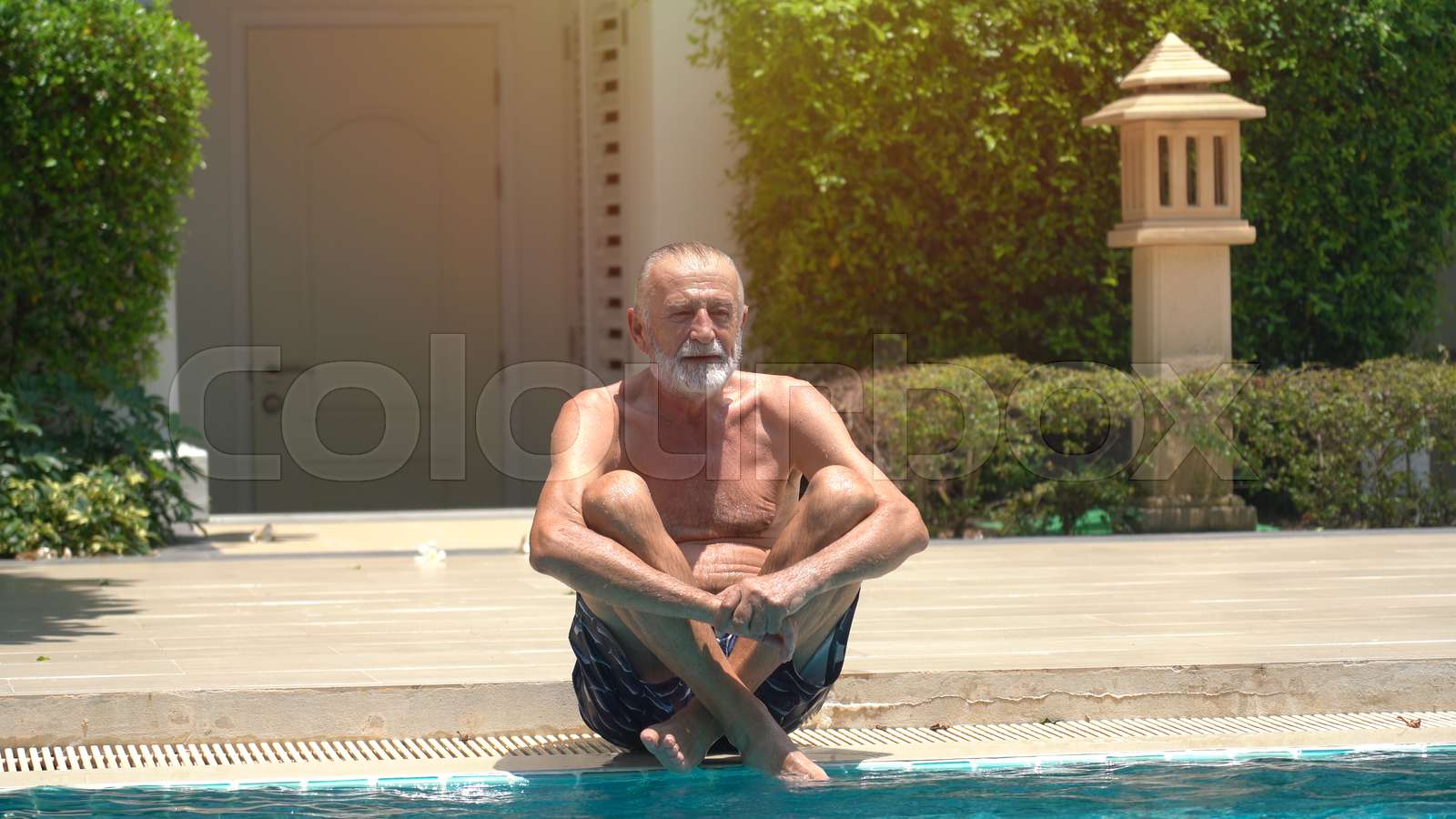 Senior man swimming in swimming pool | Stock image | Colourbox