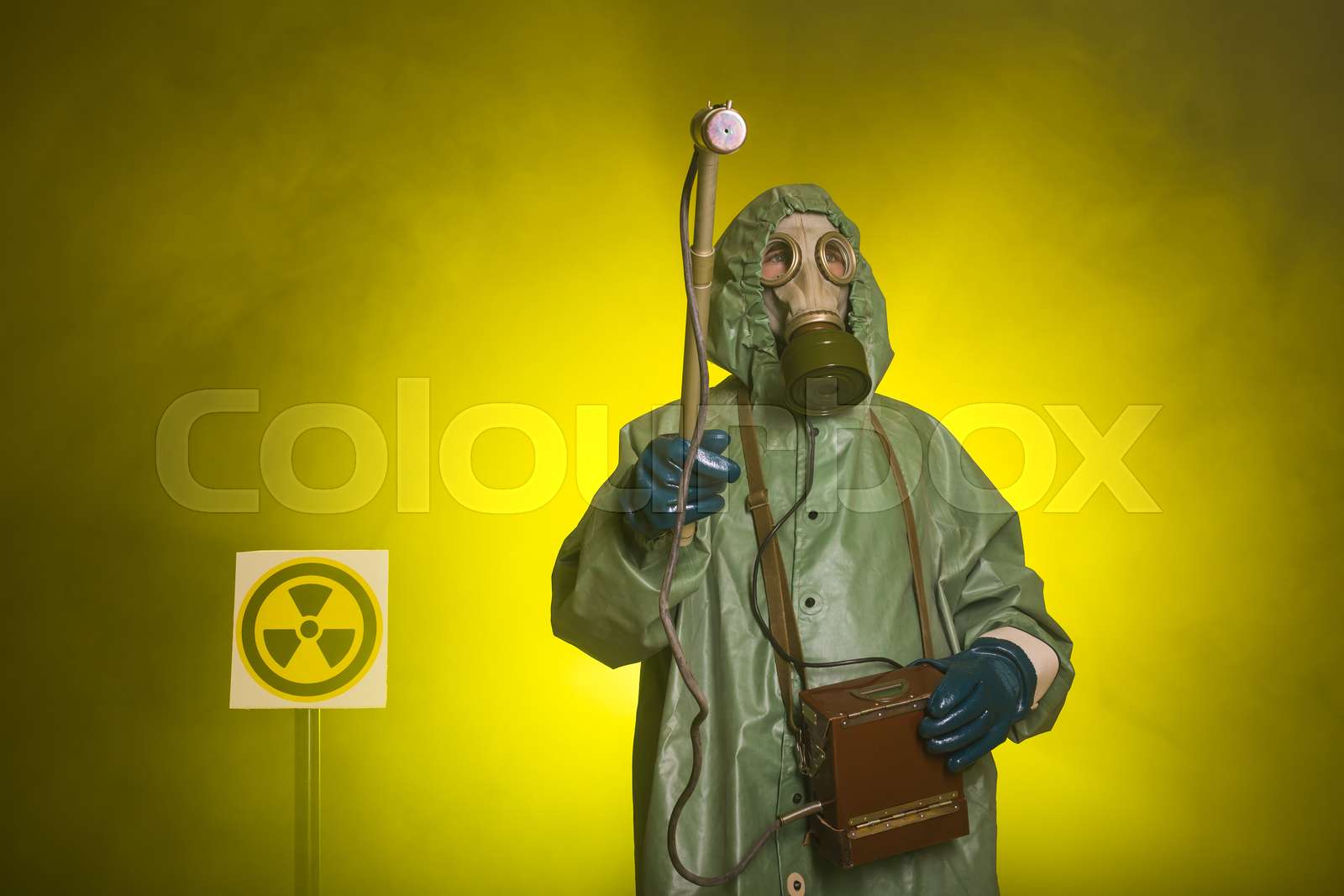 Radiation and danger concept - Man in the gas mask and chemical suit ...