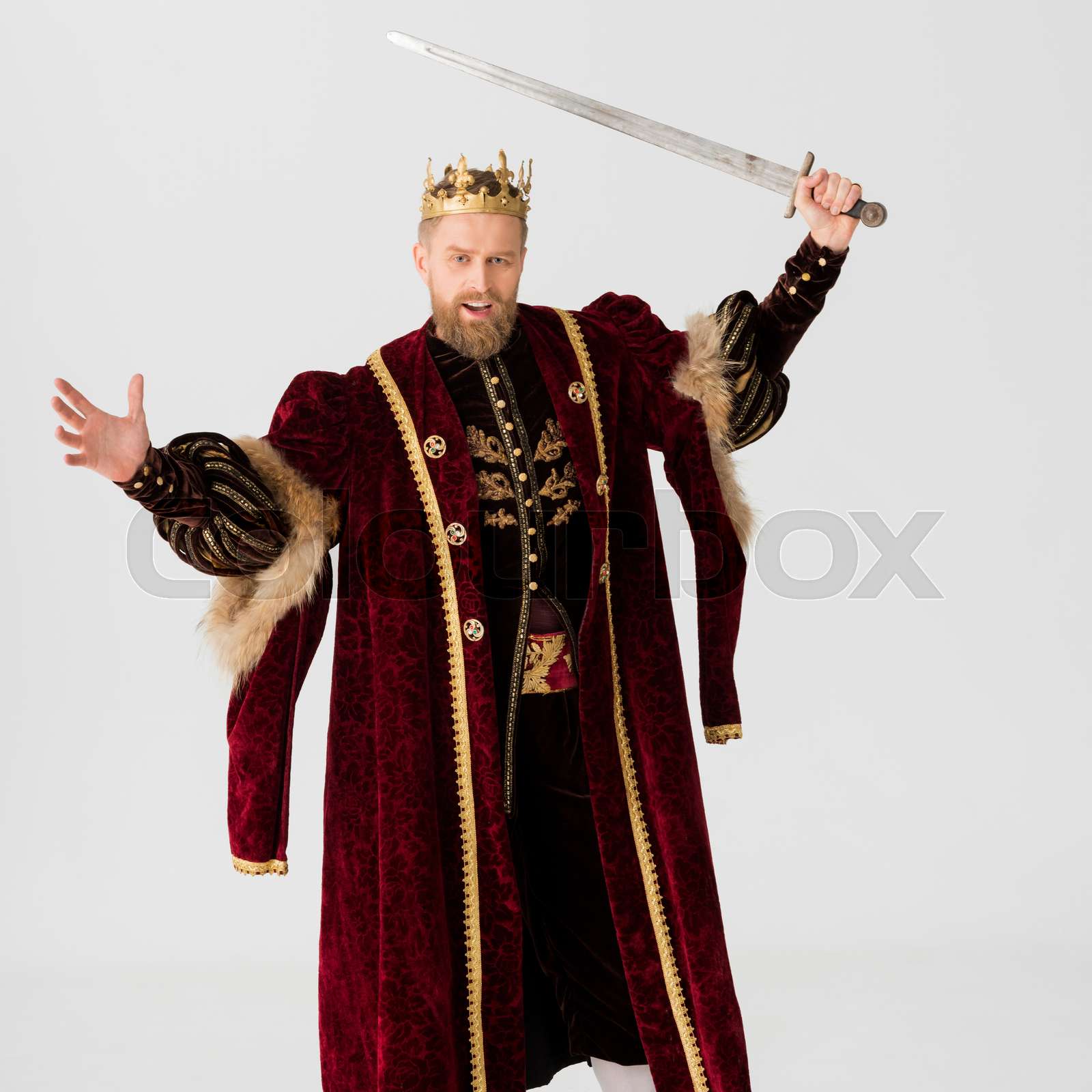 angry king with crown holding sword isolated on grey | Stock image ...
