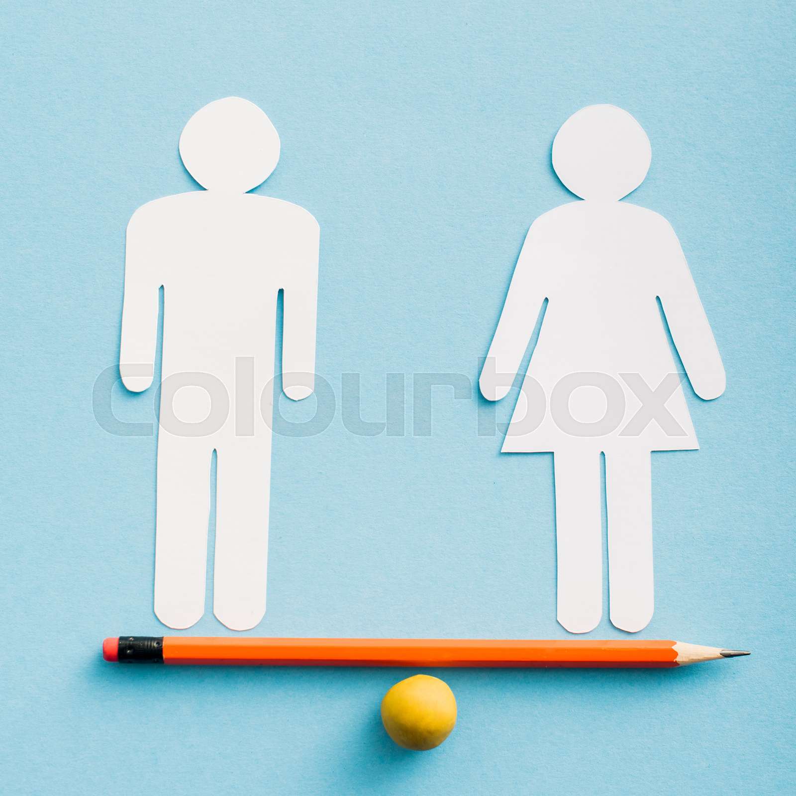 paper cut figures of couple as gender equality on pencil with small ...