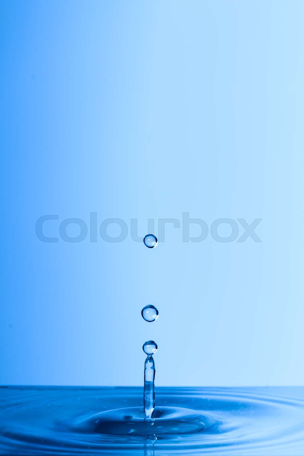 Water drop fall into water | Stock image | Colourbox