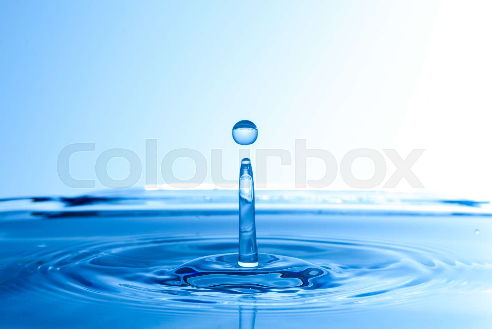 Water drop fall into water | Stock image | Colourbox