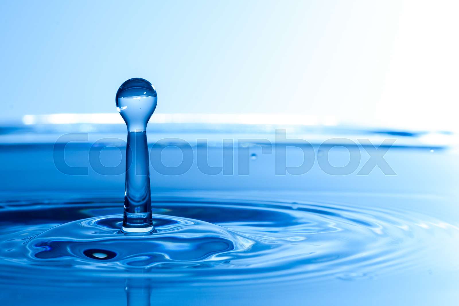 Water drop fall into water | Stock image | Colourbox