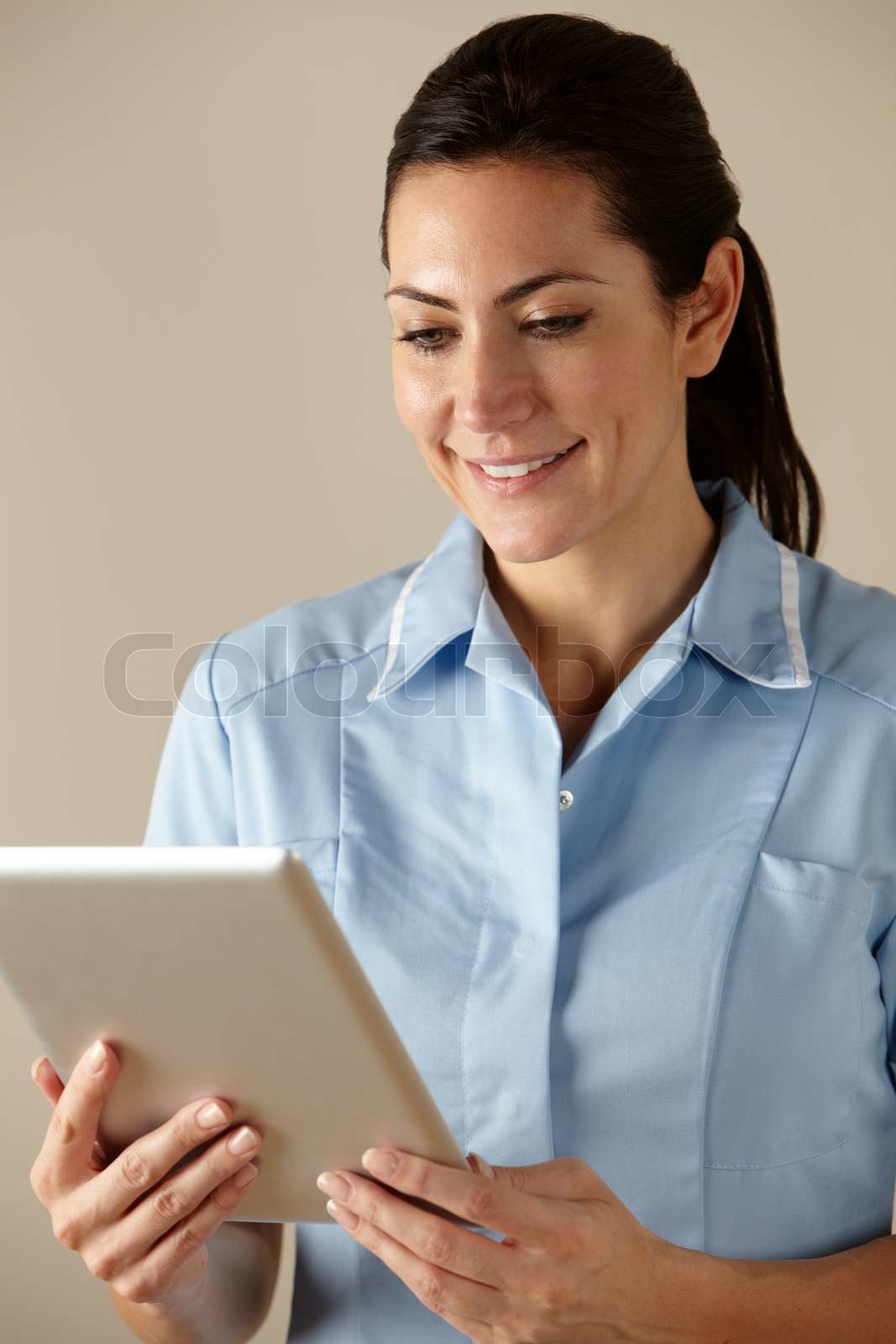UK nurse using computer tablet | Stock image | Colourbox