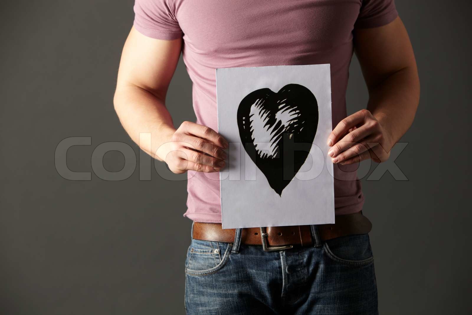 Man holding ink drawing of heart | Stock image | Colourbox