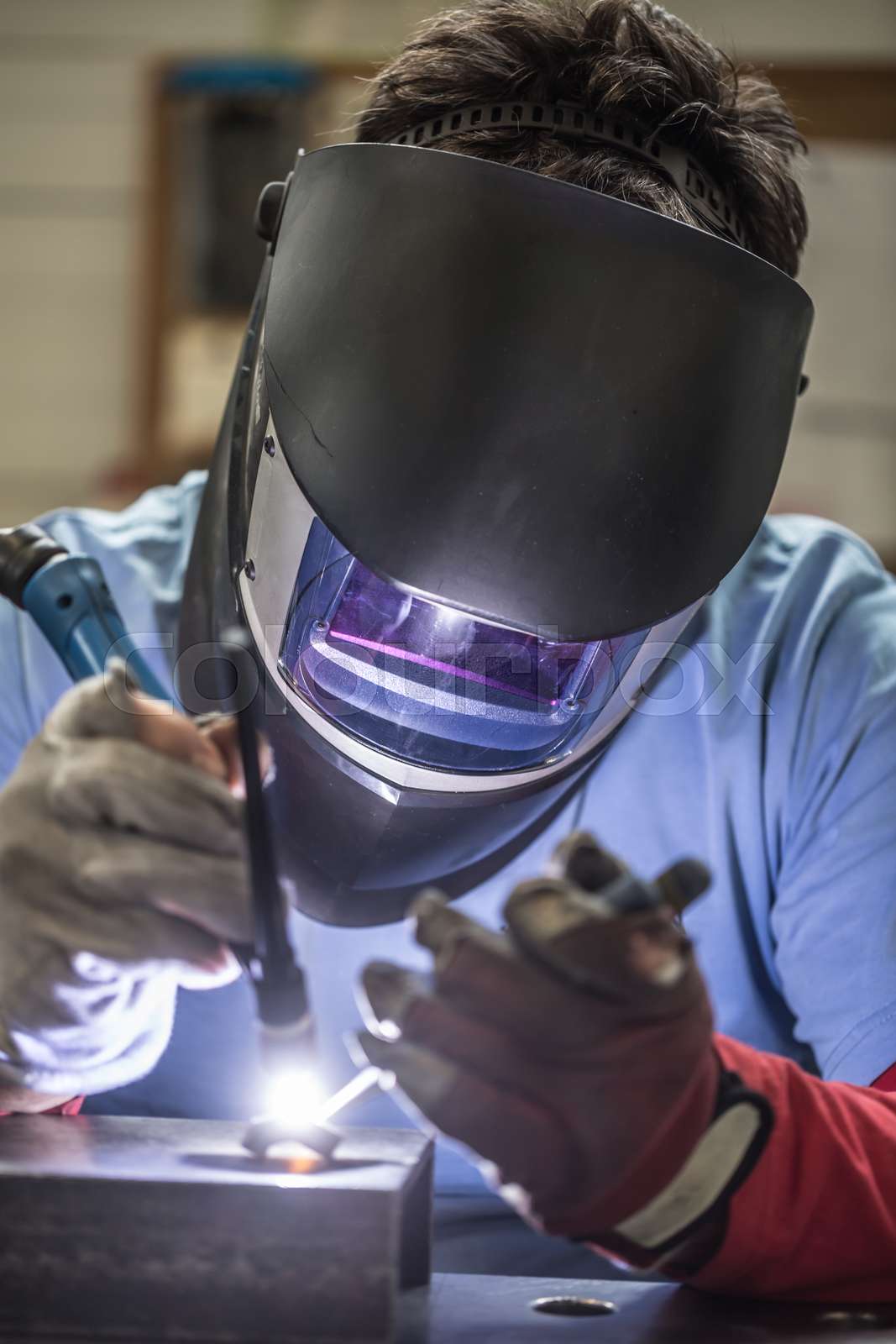 Welder industrial worker welding with argon machine | Stock image ...