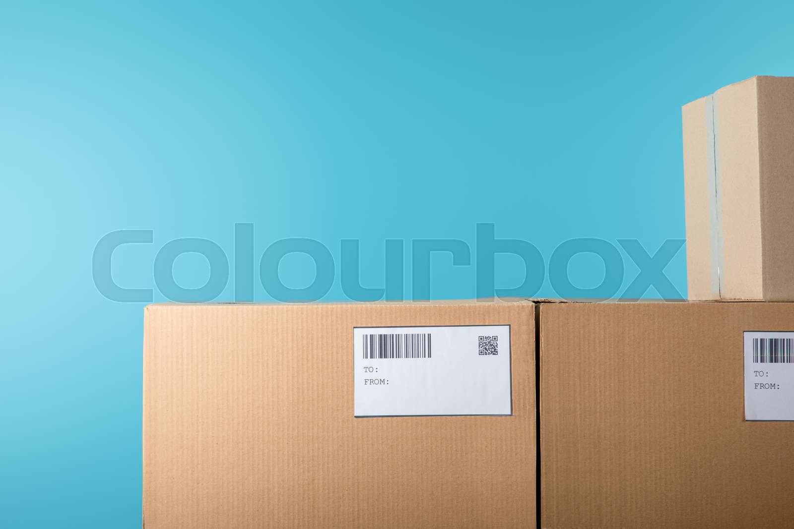 Cards with qr code and barcodes on cardboard boxes isolated on blue ...