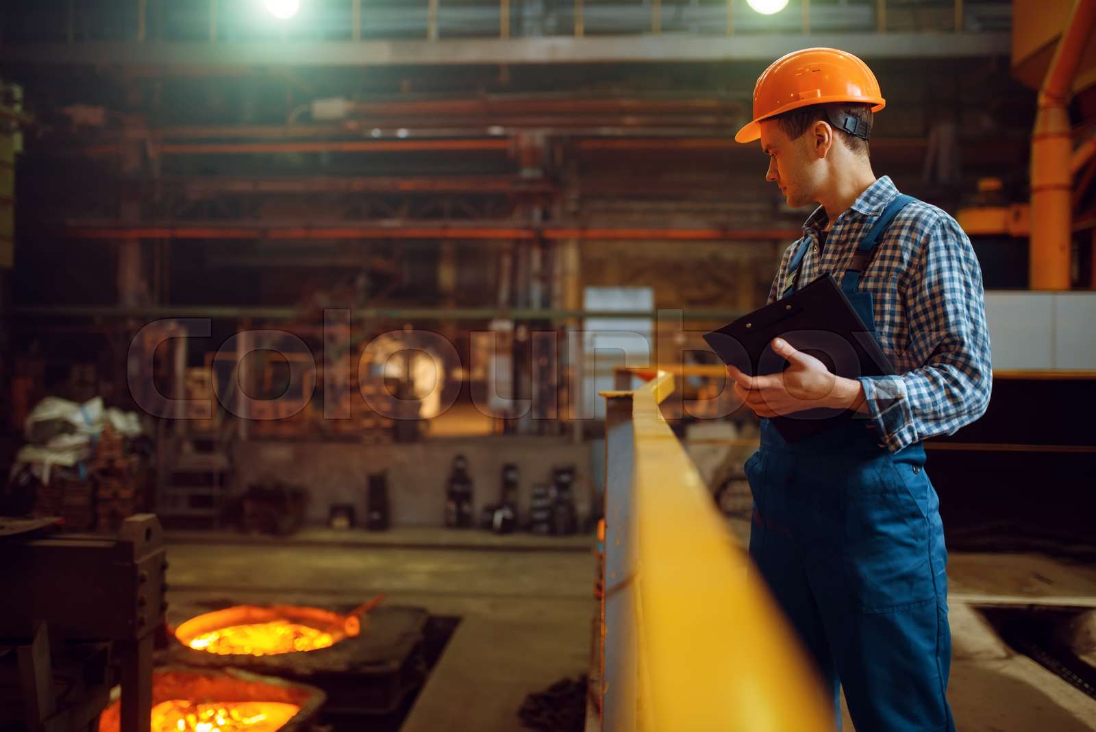 Steelmaker controls steelmaking process on factory | Stock image ...