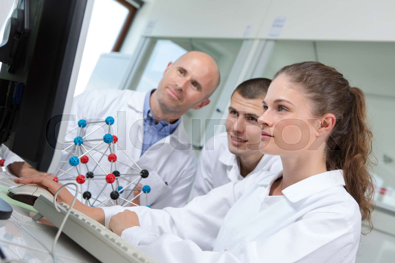 pupils carrying out experiment in science class | Stock image | Colourbox