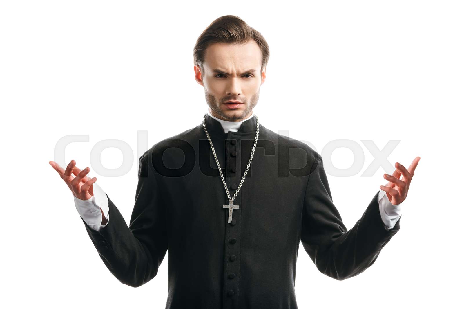 confident, serious catholic priest standing with open arms isolated on ...