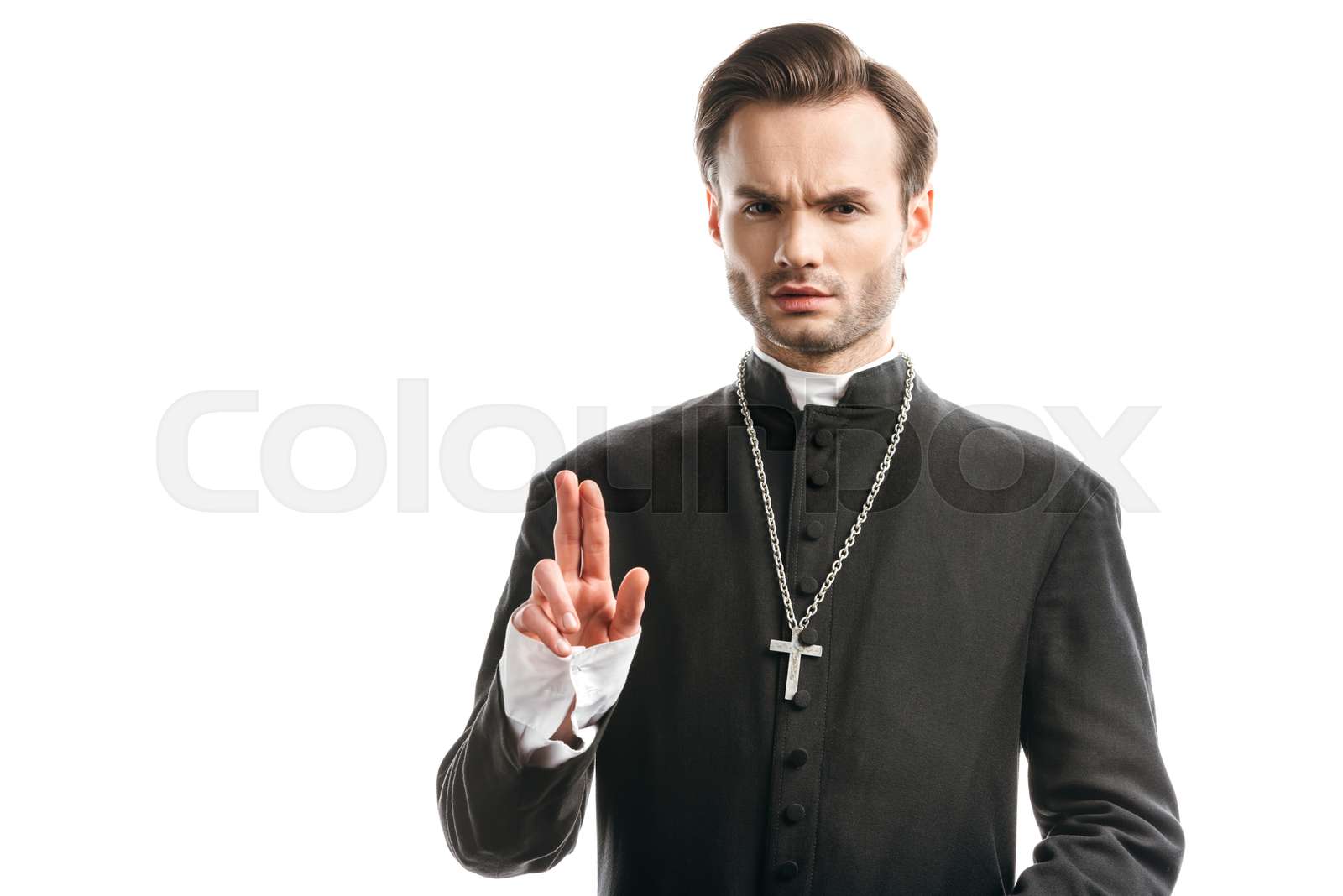 confident, strict catholic priest showing blessing gesture isolated on ...