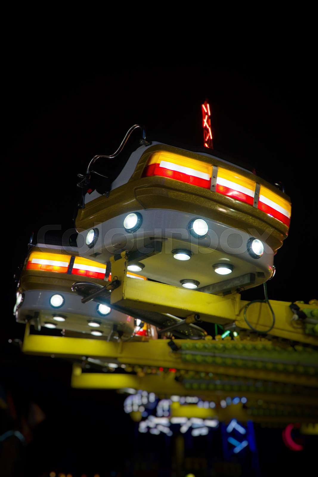 Hurricane ride in the city amusement park at evening. | Stock image ...