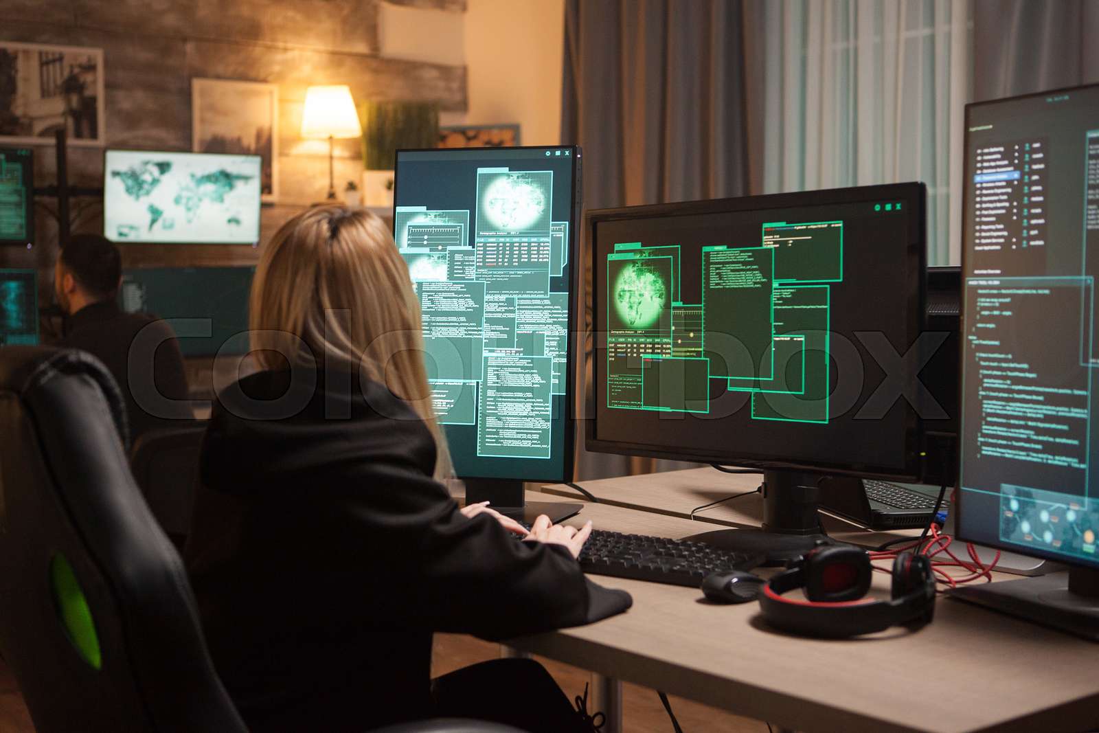 Female Hacker Using Keyboard To Type A Dangerous Malware Stock Image