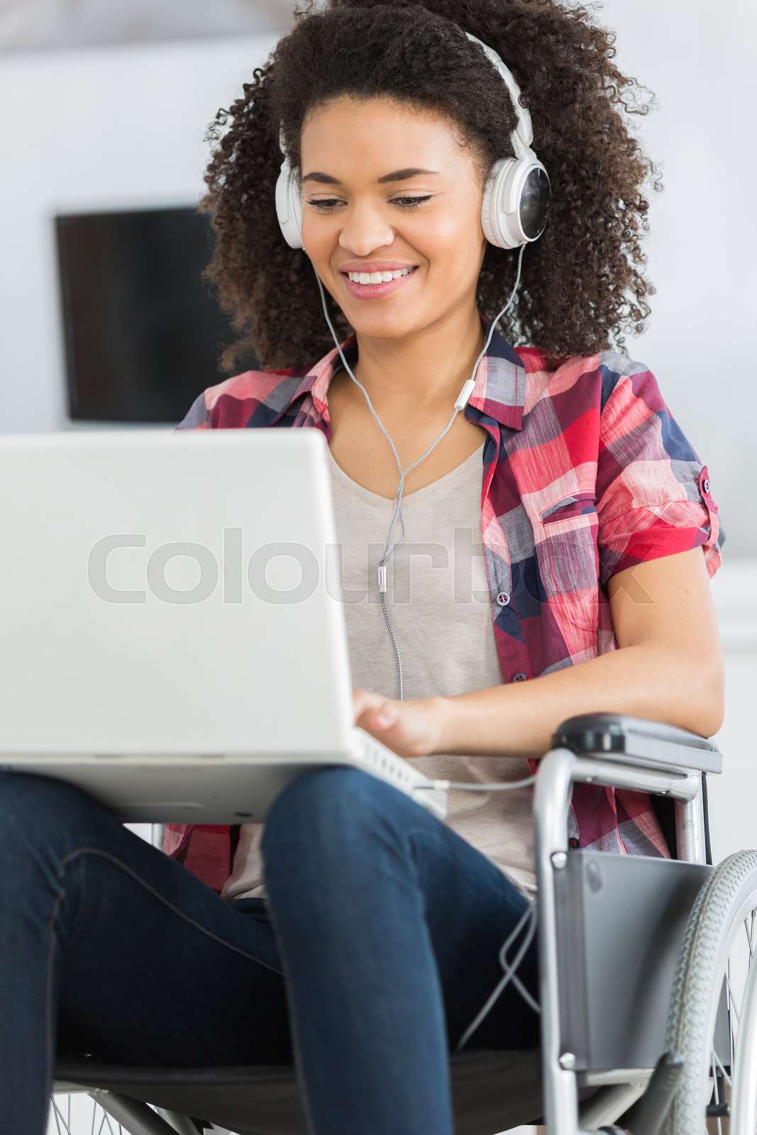 disabled woman in wheelchair with laptop | Stock image | Colourbox