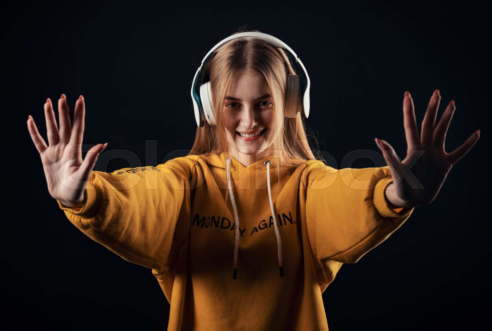 Lady with headphones, arms forward | Stock image | Colourbox