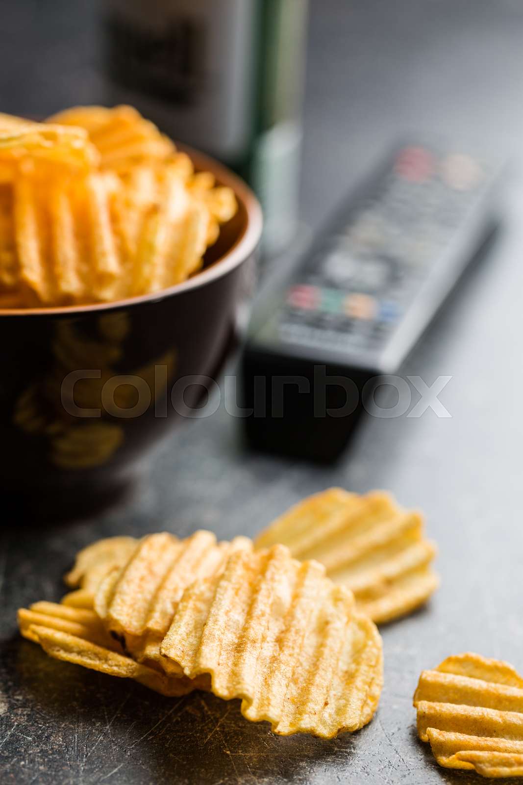 Crinkle cut potato chips. | Stock image | Colourbox