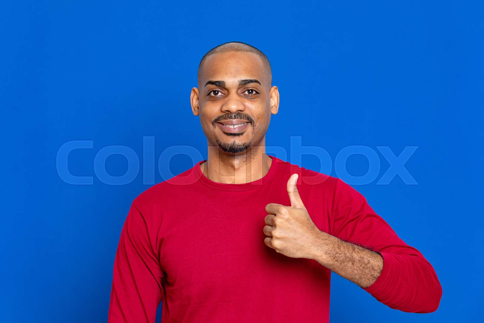 African man with red T-shirt | Stock image | Colourbox
