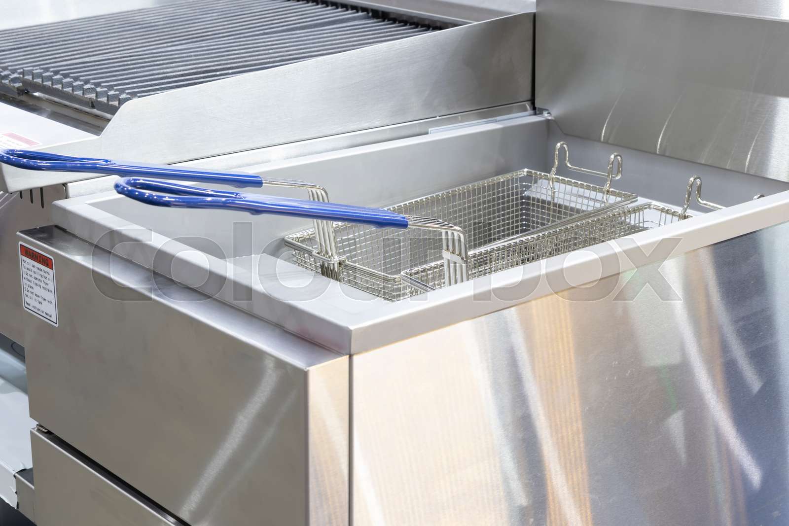 New empty modern professional deep fryer basket for kitchen restaurant ...