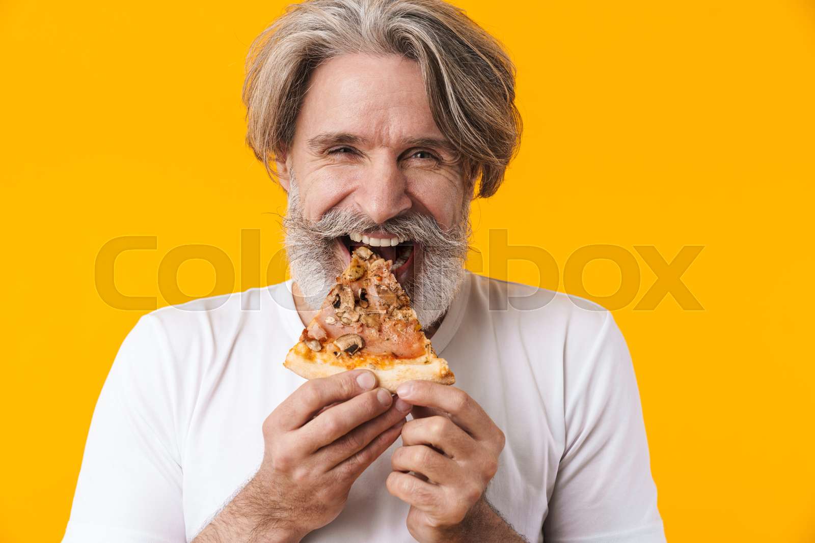 Emotional senior man holding pizza. | Stock image | Colourbox